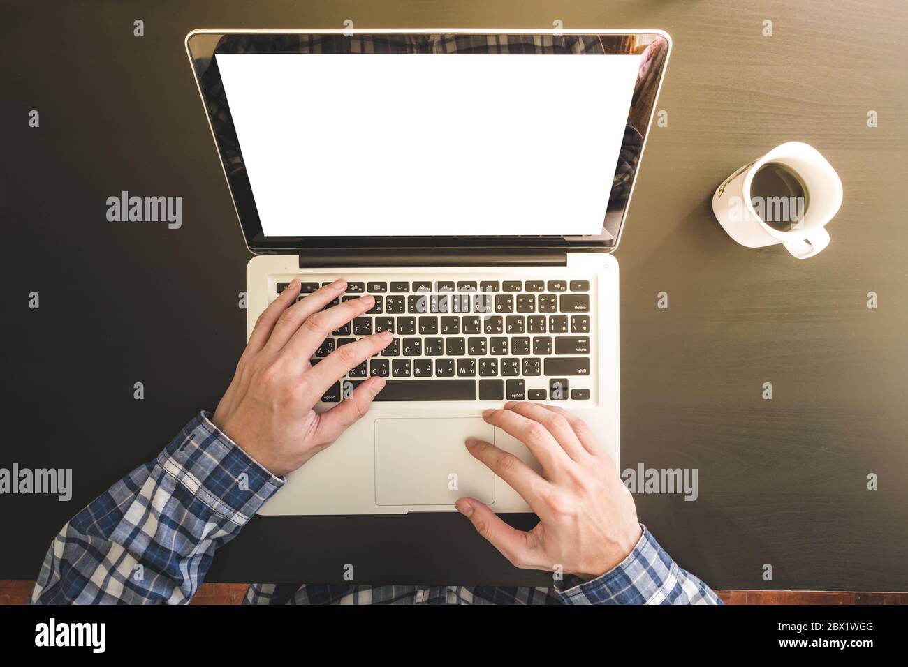 Top view of Male hands working on Laptop, Cup of coffee on the desk ...