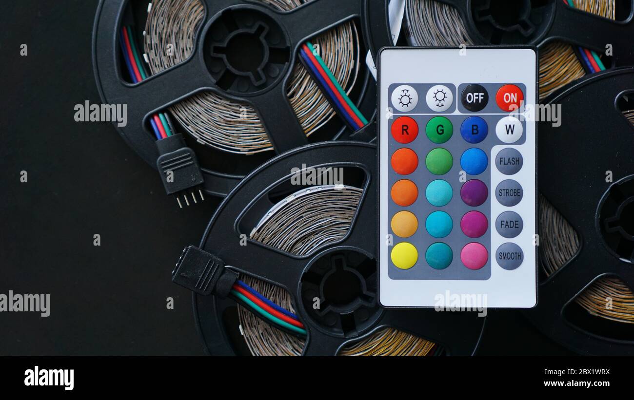 Three Led strip coils closeup. Diode with control panel for switching ...