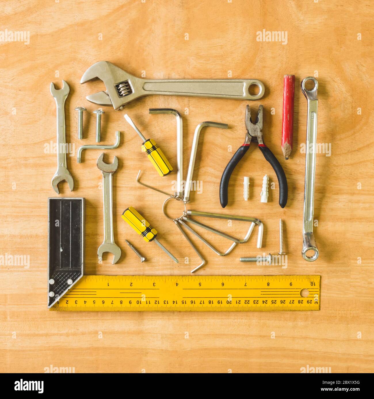 Set of different work tools on wooden table background Stock Photo - Alamy