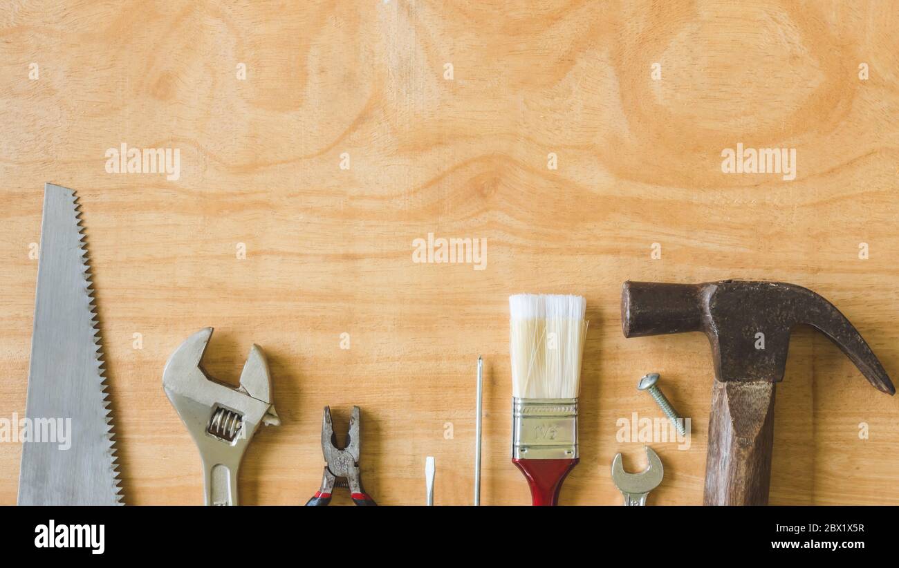 Set of different work tools on wooden table background Stock Photo - Alamy