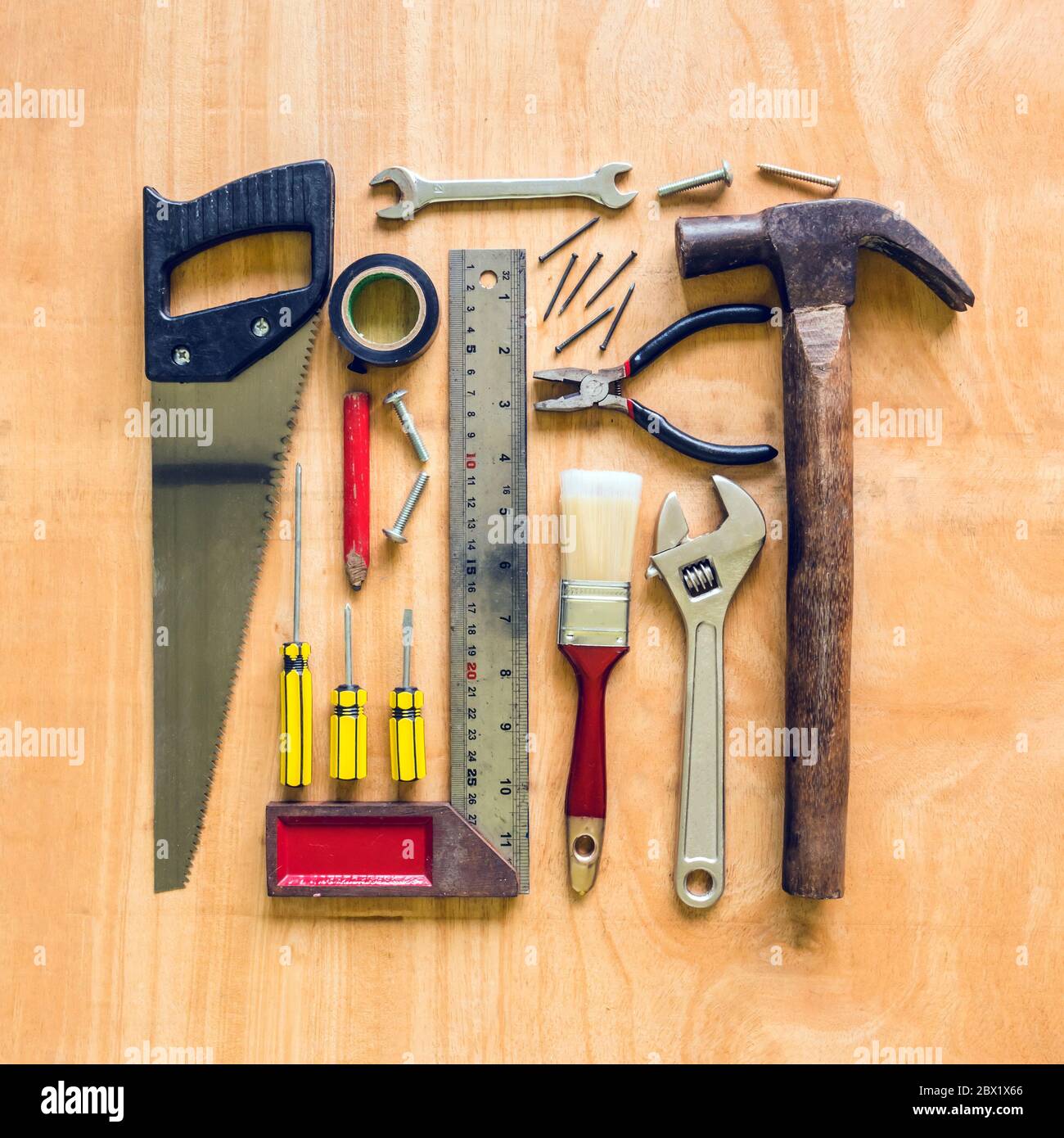 Set of different work tools on wooden table background Stock Photo - Alamy