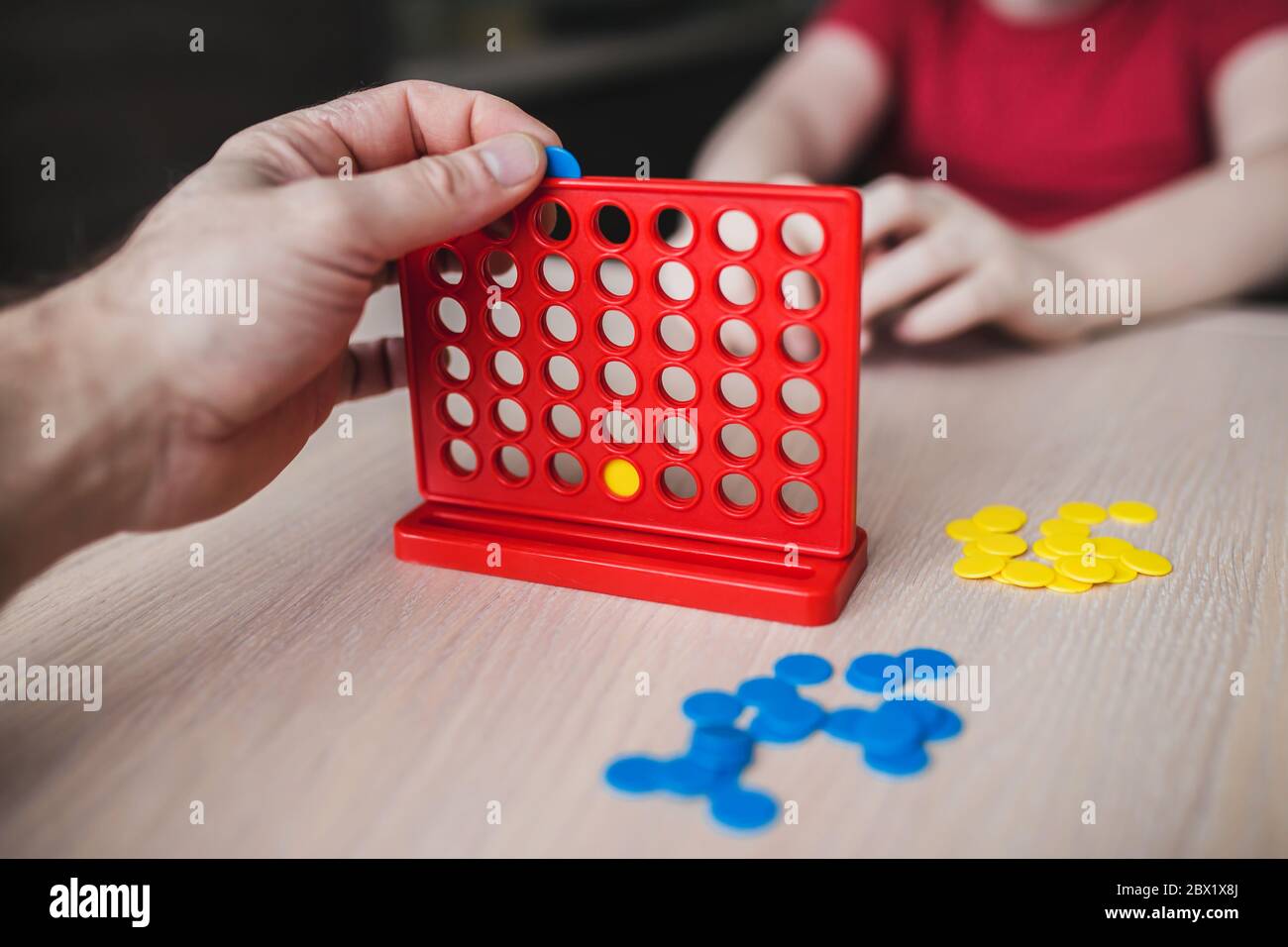 Board games during leisure time - four in a line Stock Photo - Alamy