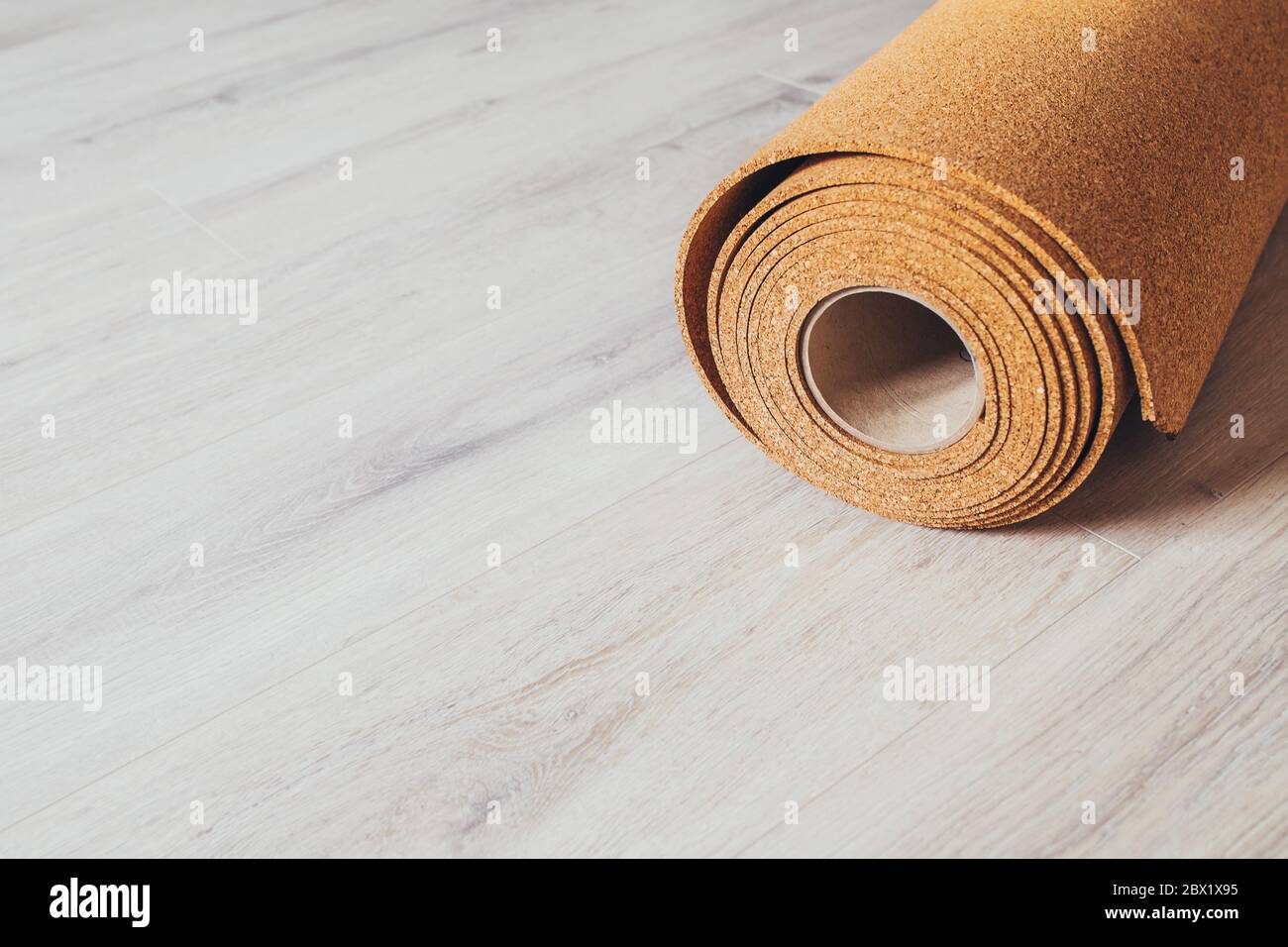 The master lays the cork substrate on the floor before laying the ...