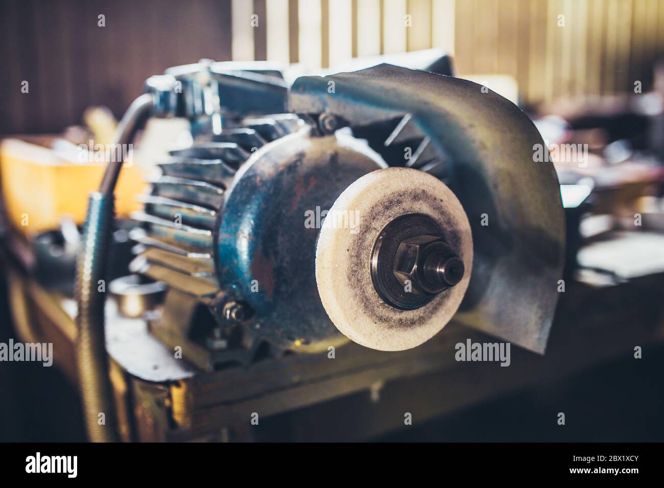 Electrocuting machine - grinding stone on a metal workbench Stock Photo ...