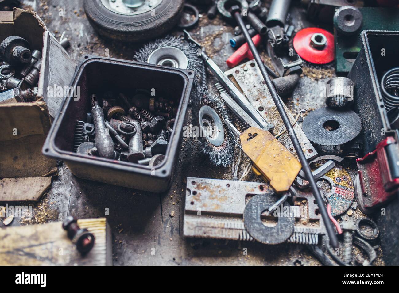 Tools and parts on the bench - work mess Stock Photo - Alamy