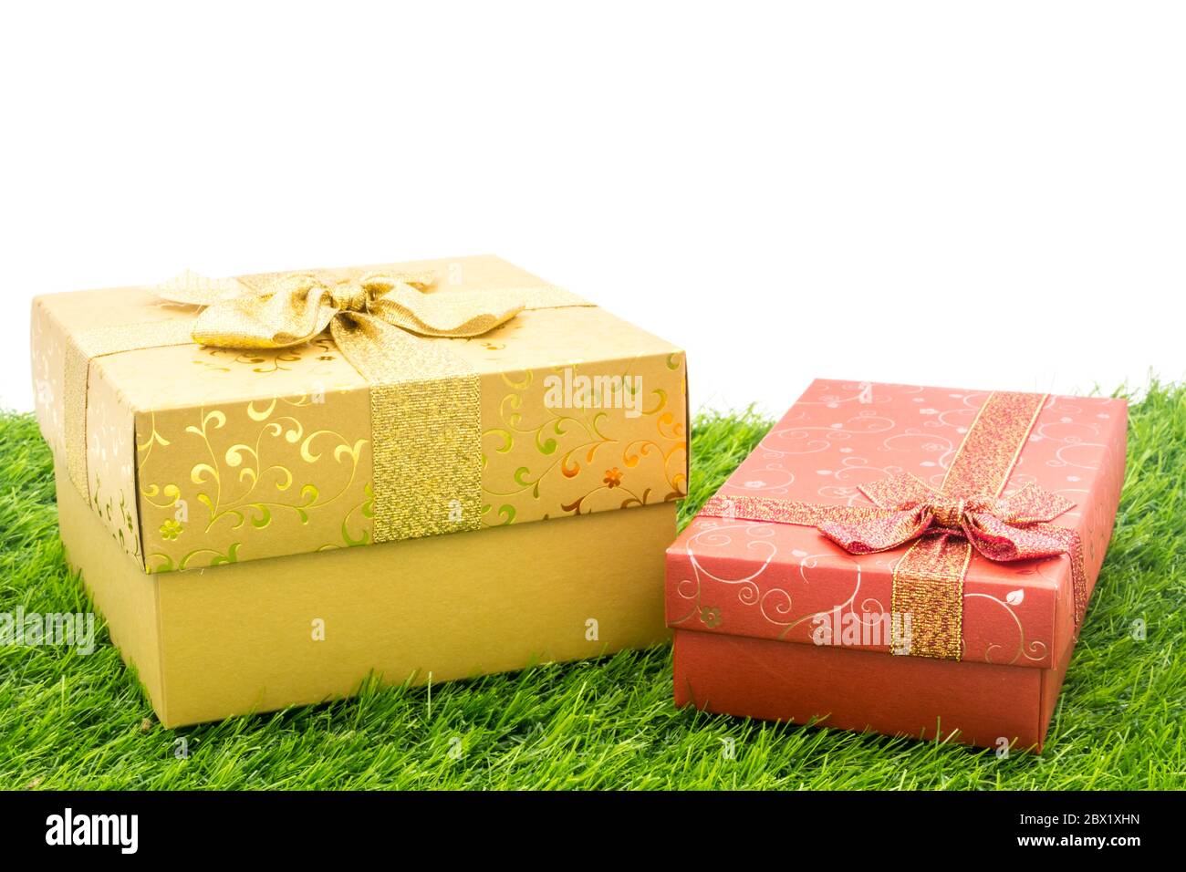 The Gift boxes on the green grass ground Stock Photo - Alamy
