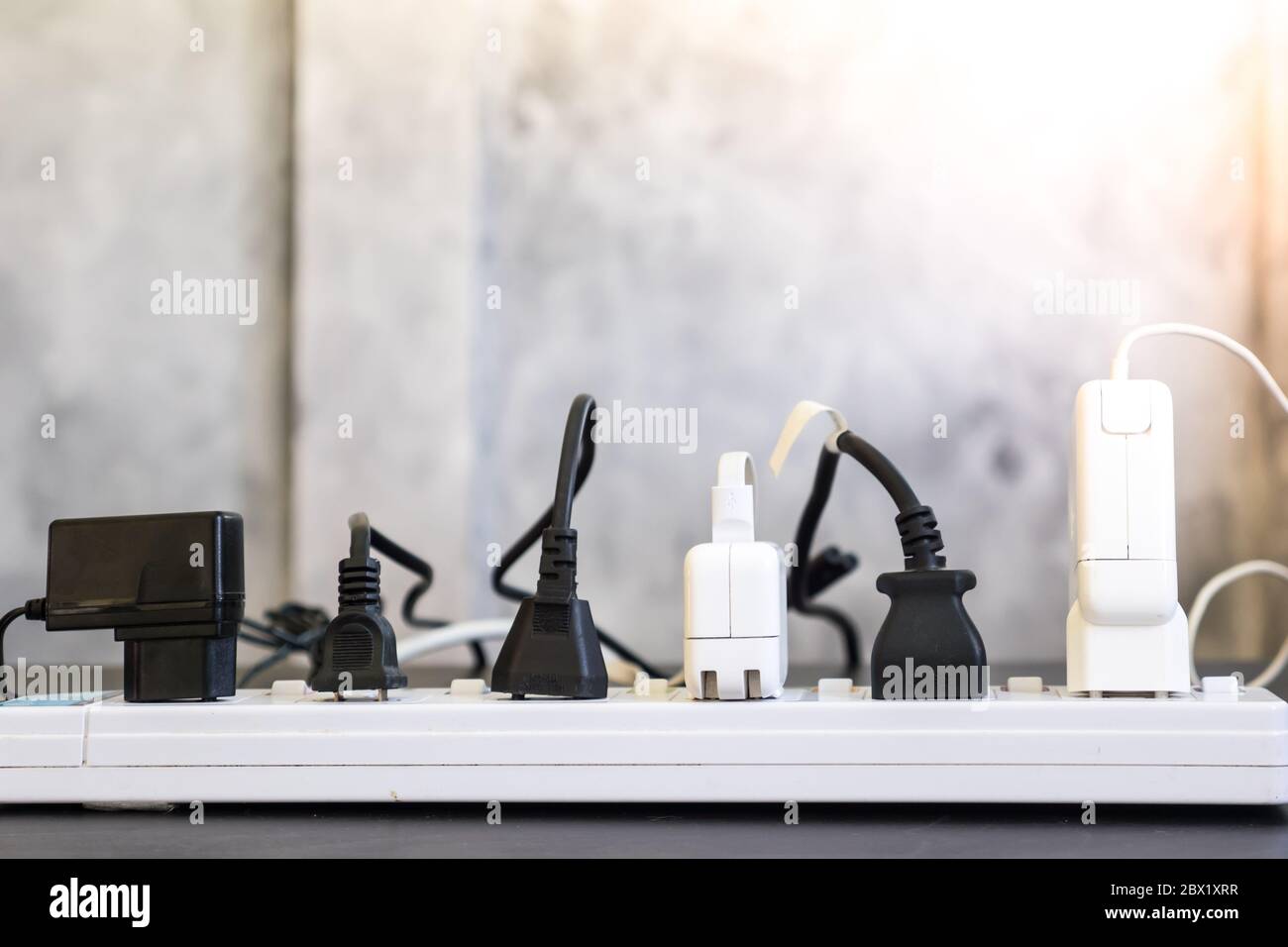 Multiple socket with connected plugs Stock Photo - Alamy