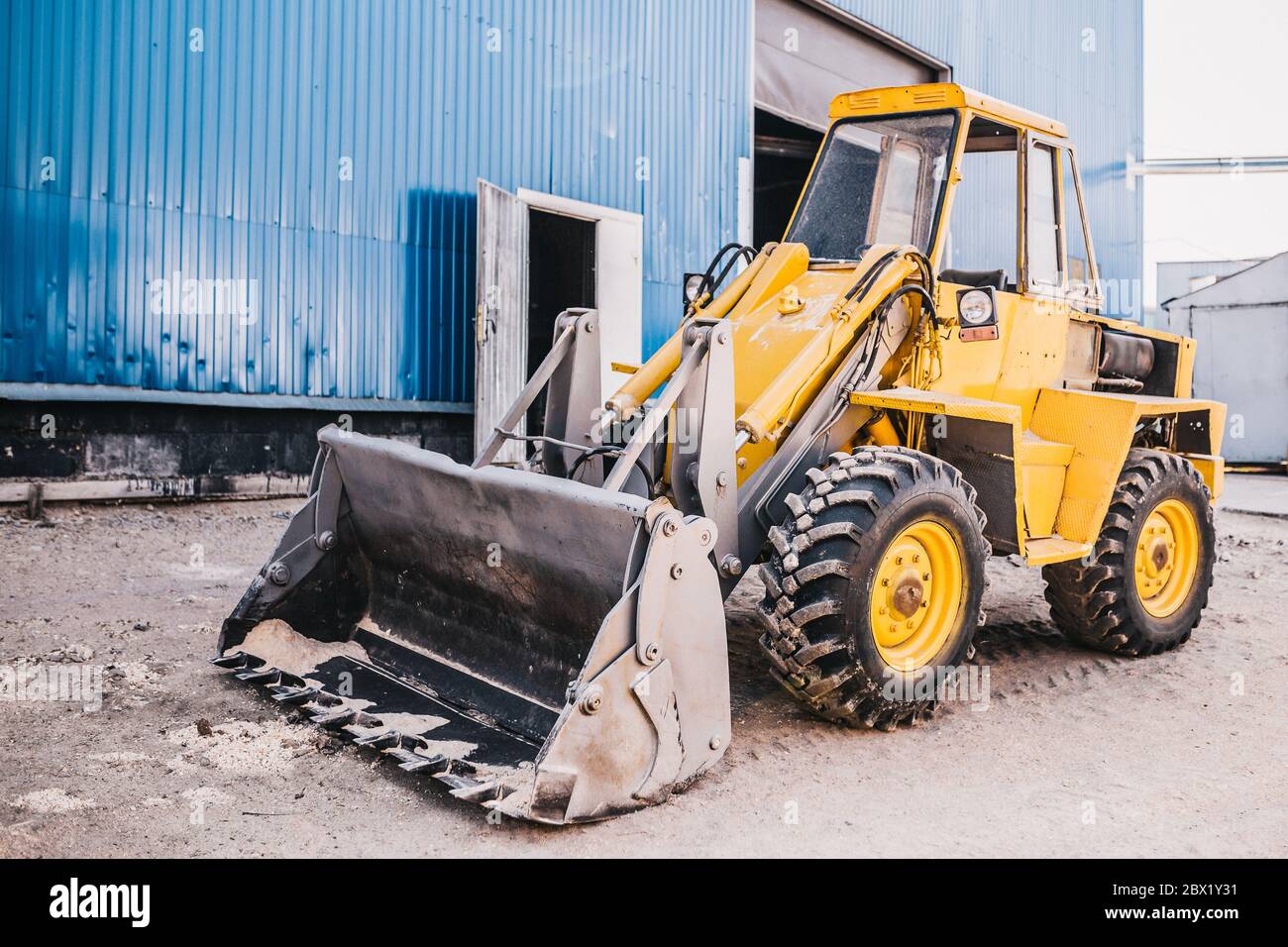 Heavy machine with bucket - tractor loader or excavator Stock Photo - Alamy