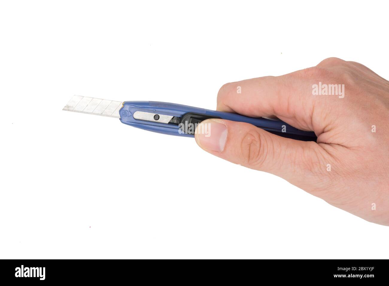 Hand holding cutter knife on white background Stock Photo - Alamy