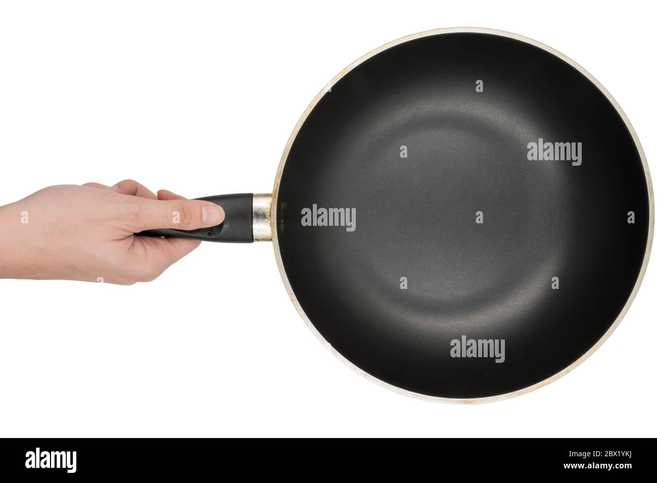 hand holding a empty pan on white background Stock Photo - Alamy