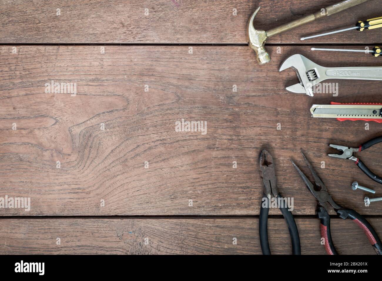 Many Tools on wooden table background Stock Photo - Alamy
