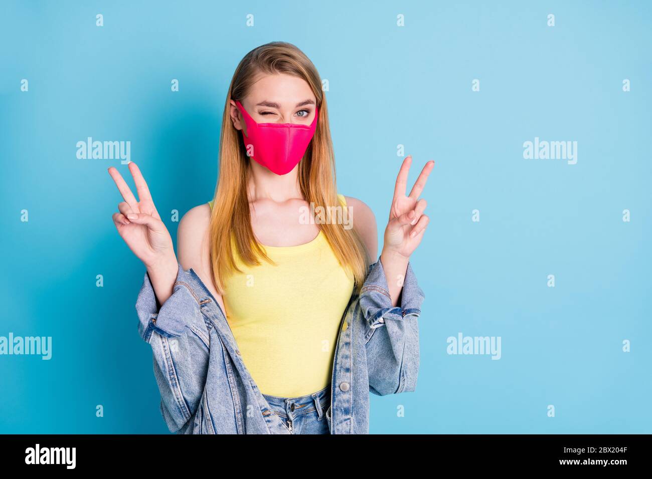 Photo of pretty flirty lady social distancing showing v-sign symbols ...