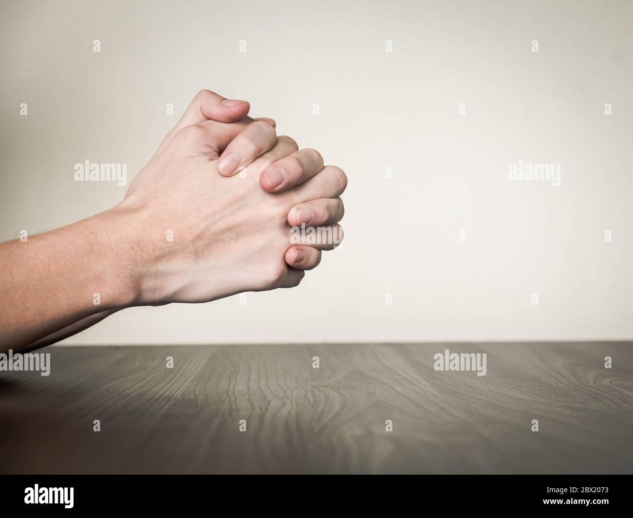 Hands folded together hi-res stock photography and images - Alamy