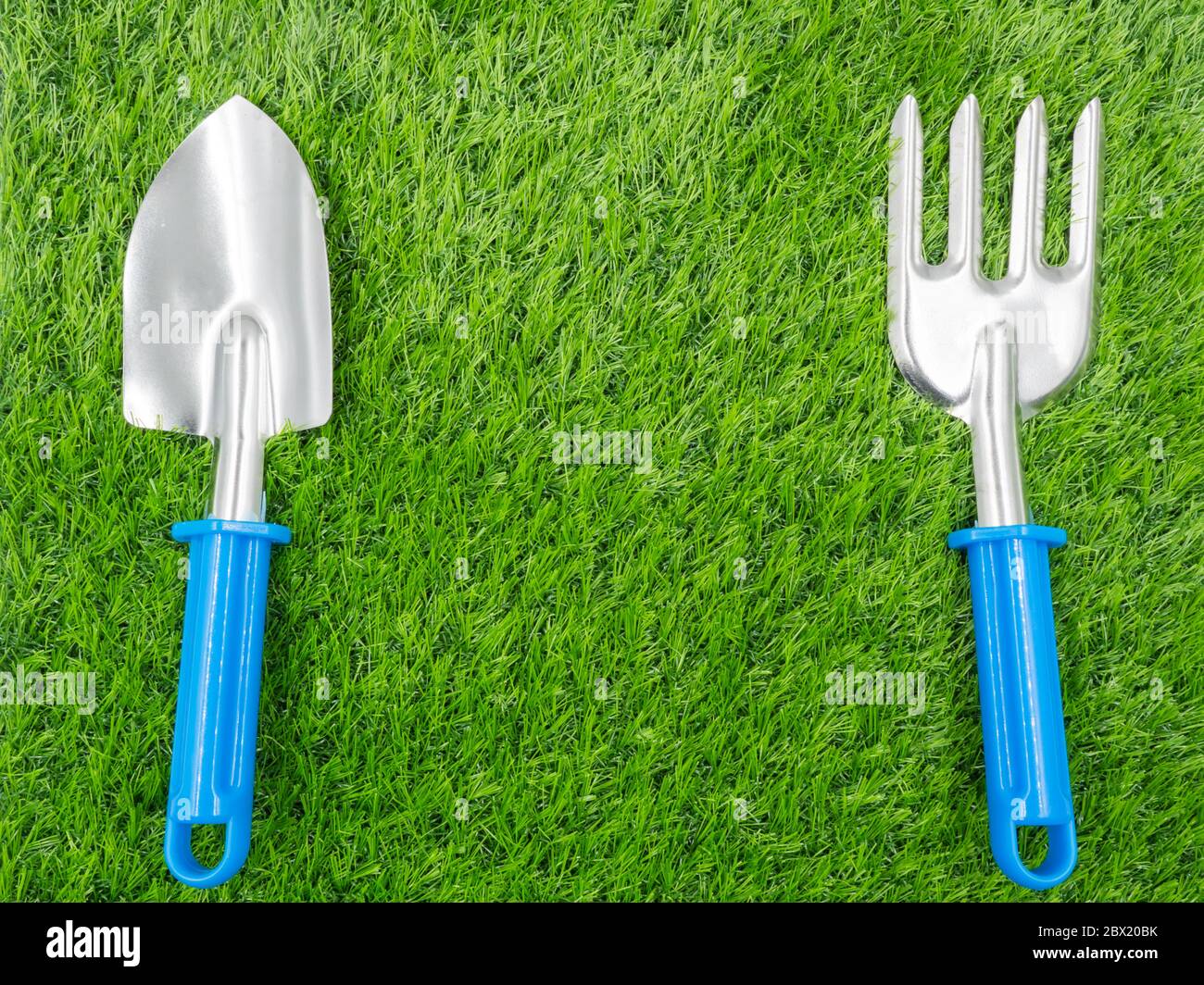 garden tools on grass background Stock Photo - Alamy