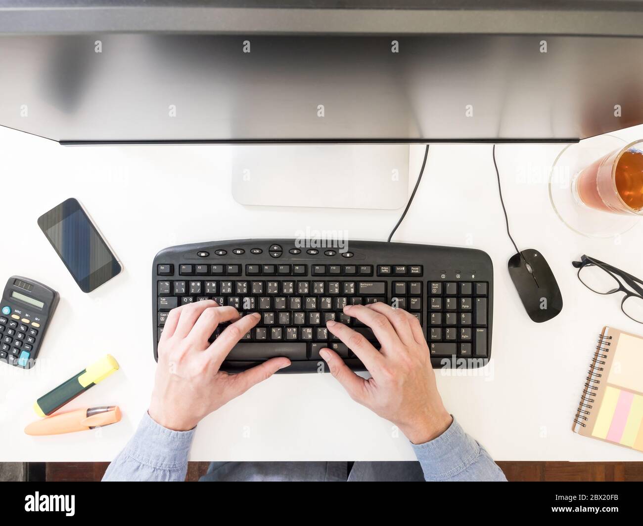 Top view of male hands working on computer on the desk Stock Photo - Alamy