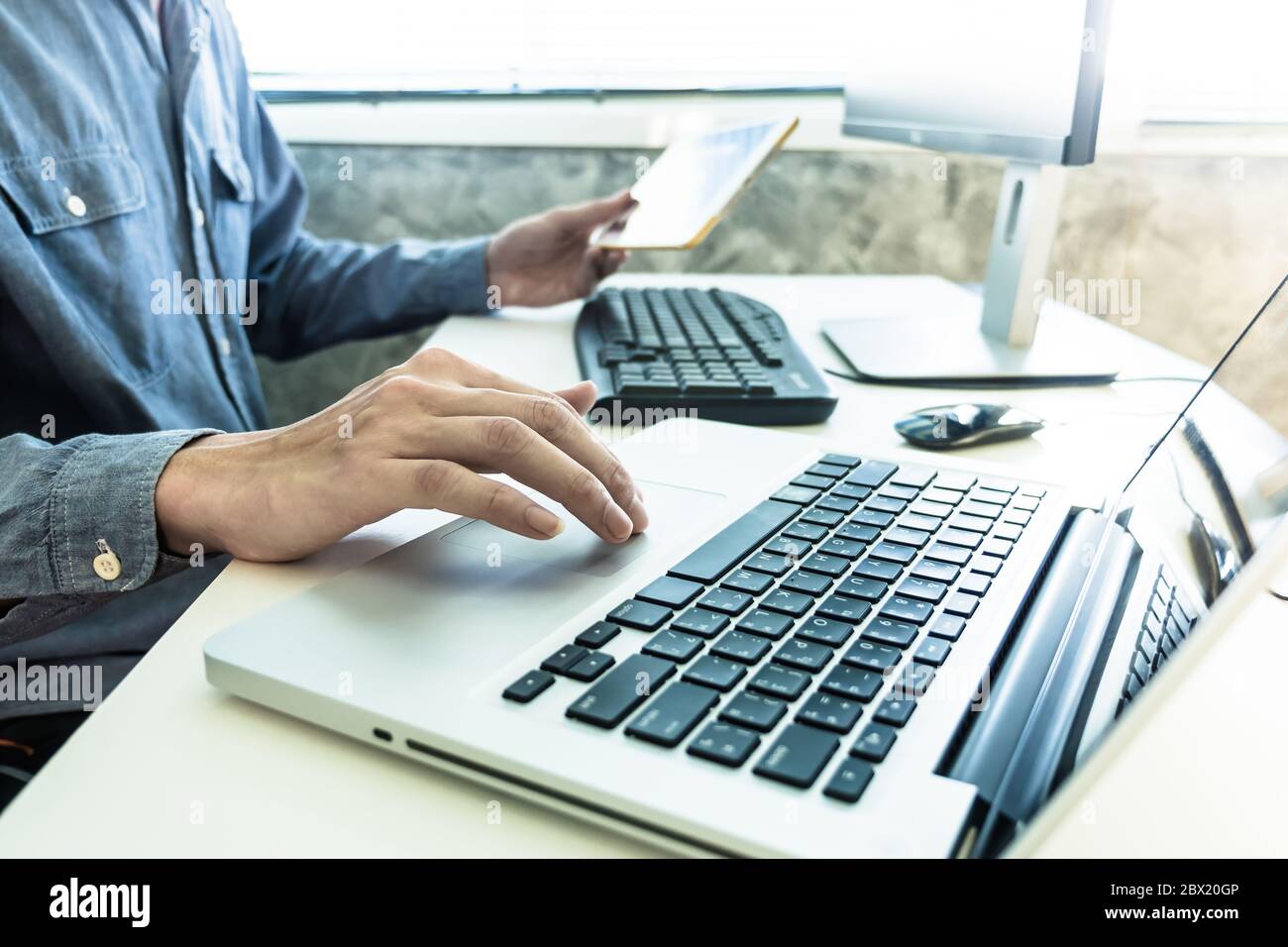 Male hands working on computer and tablet, Software programming web ...