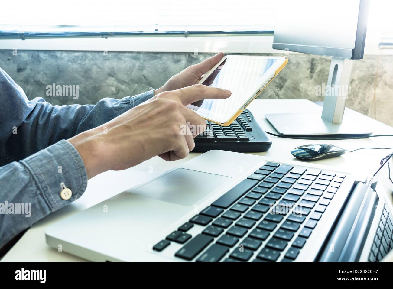 Male hands working on computer and tablet, Software programming web ...