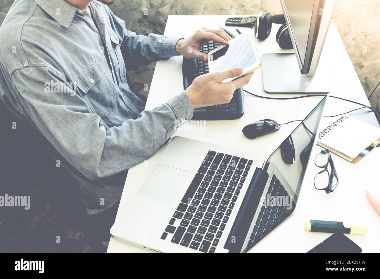 Male hands working on computer and tablet, Software programming web ...