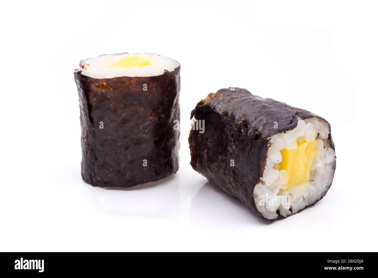 Sushi rolls of rice with egg and seaweed on white background, japanese ...
