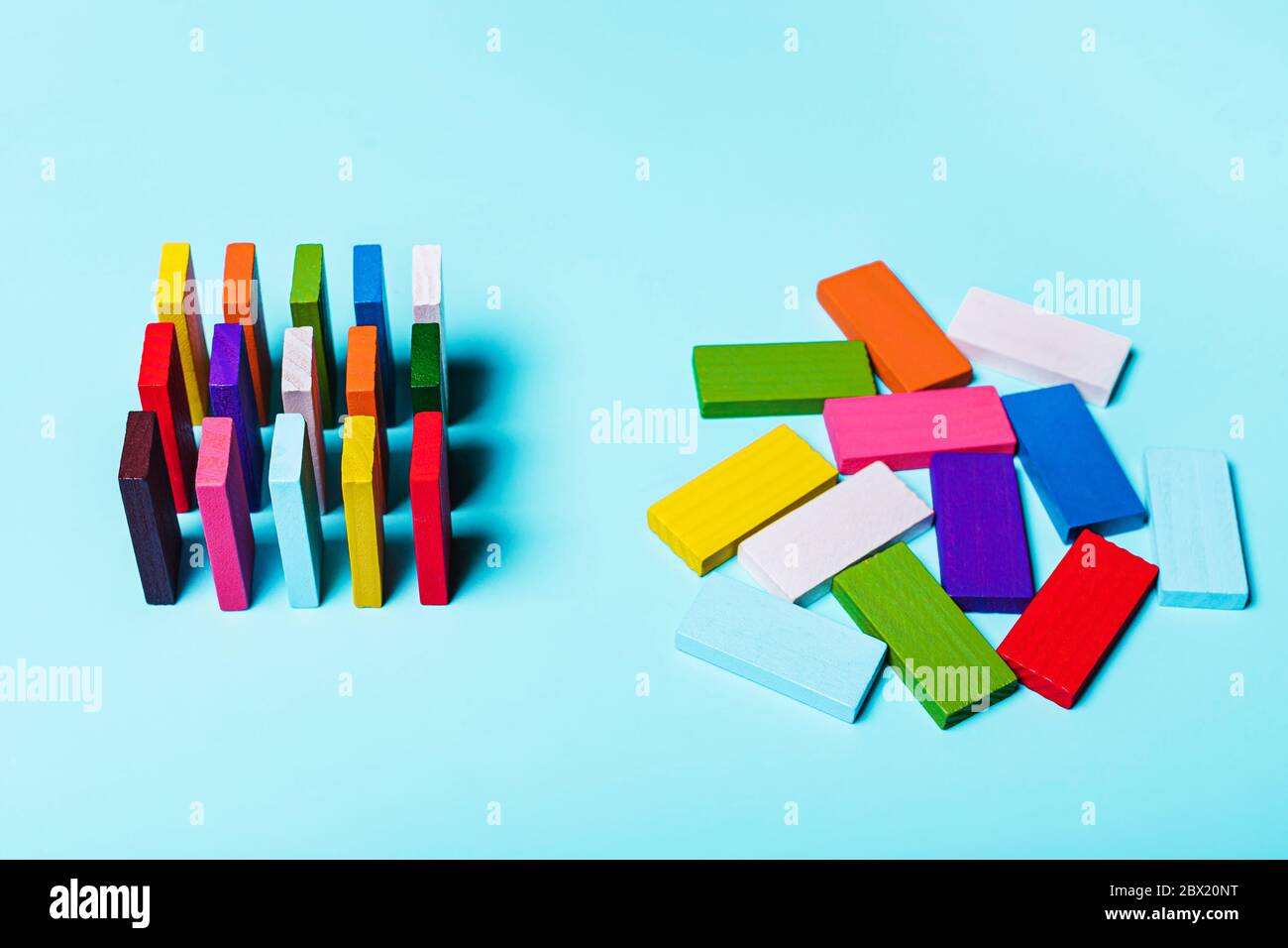 order and chaos. Chaotic unorganized colored dominoes and ordered ...