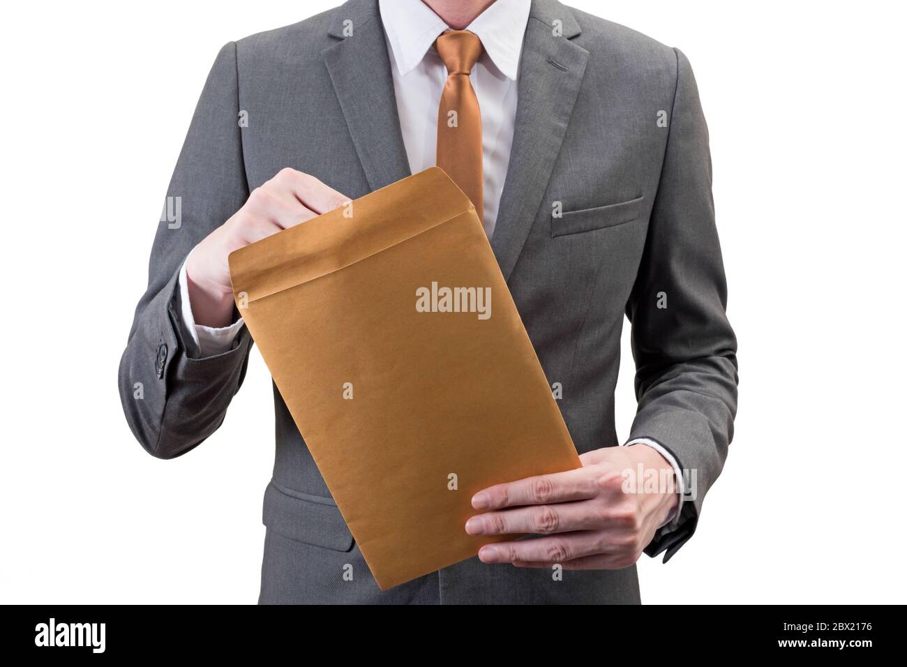 Businessman holding an envelope isolated on white background Stock ...