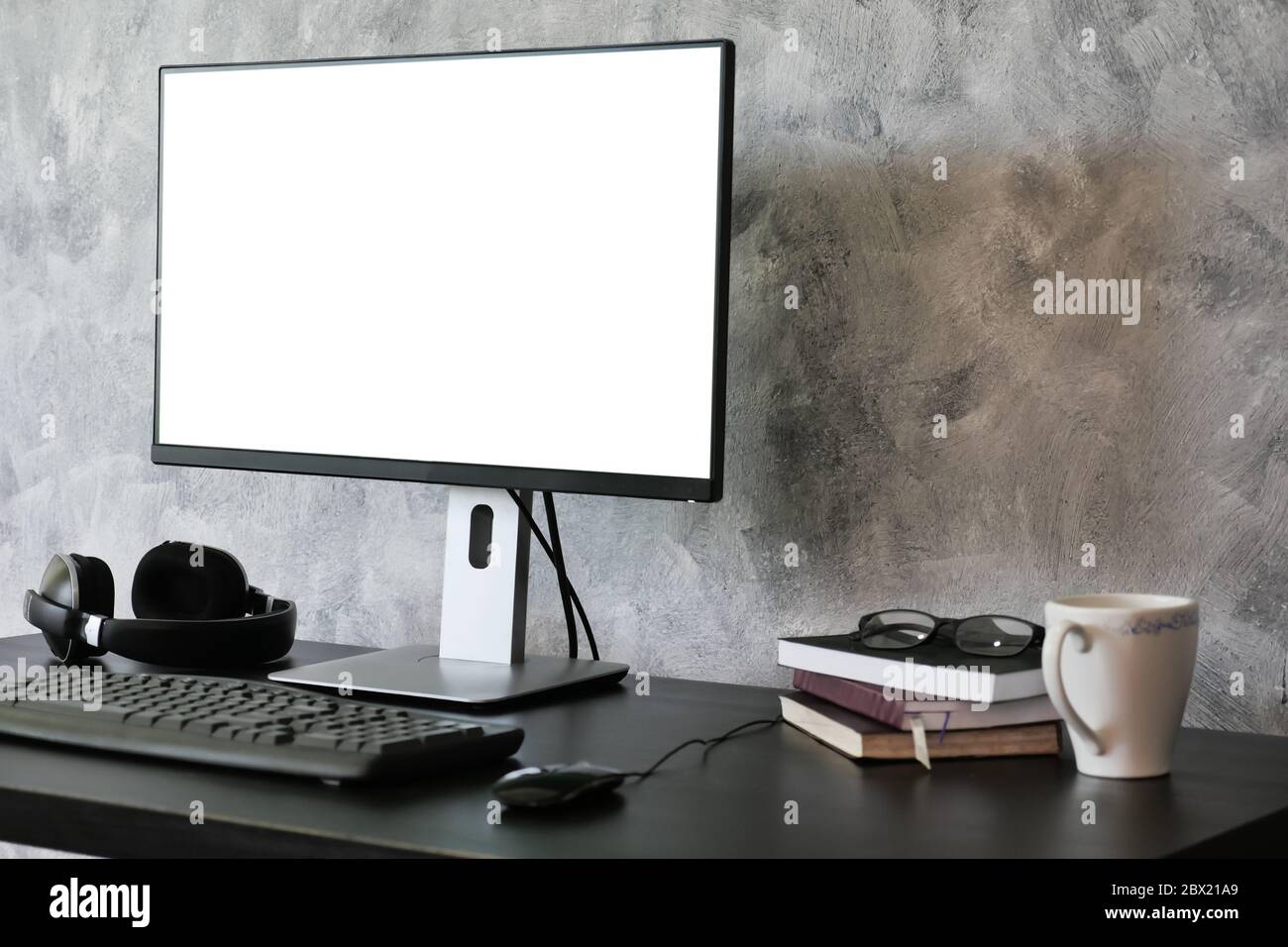 Computer with white screen monitor on the desk Stock Photo - Alamy