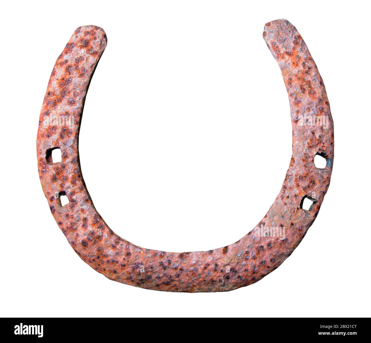 Rusty horseshoe isolated on a white background with a clipping path ...