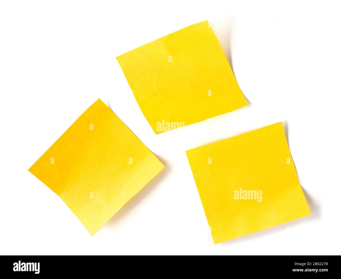 Yellow stick notes paper on white background Stock Photo - Alamy