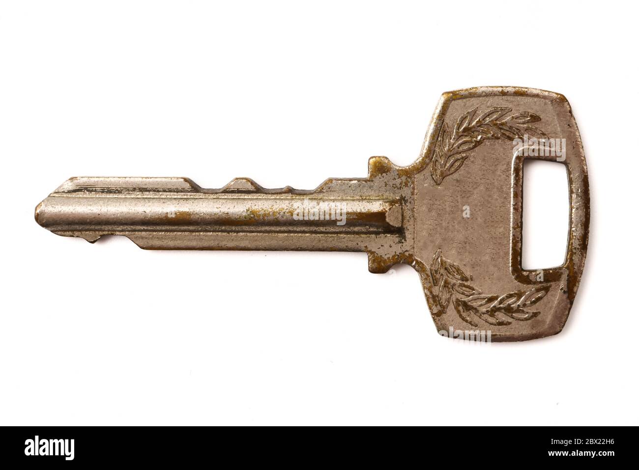 Old key on a white background Stock Photo - Alamy