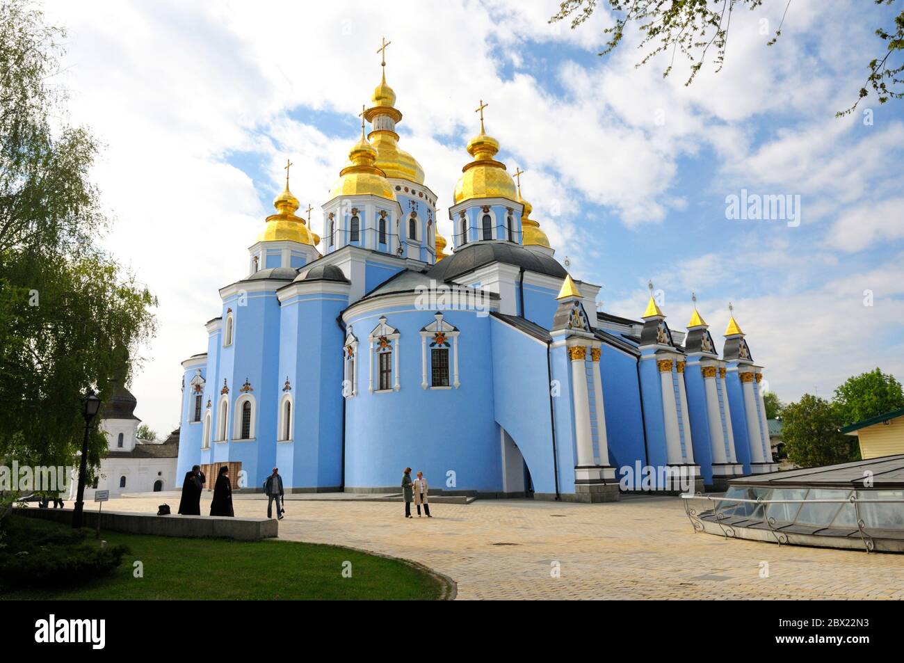 View of St. Michael Golden-Domed Monastery and monks people walking ...