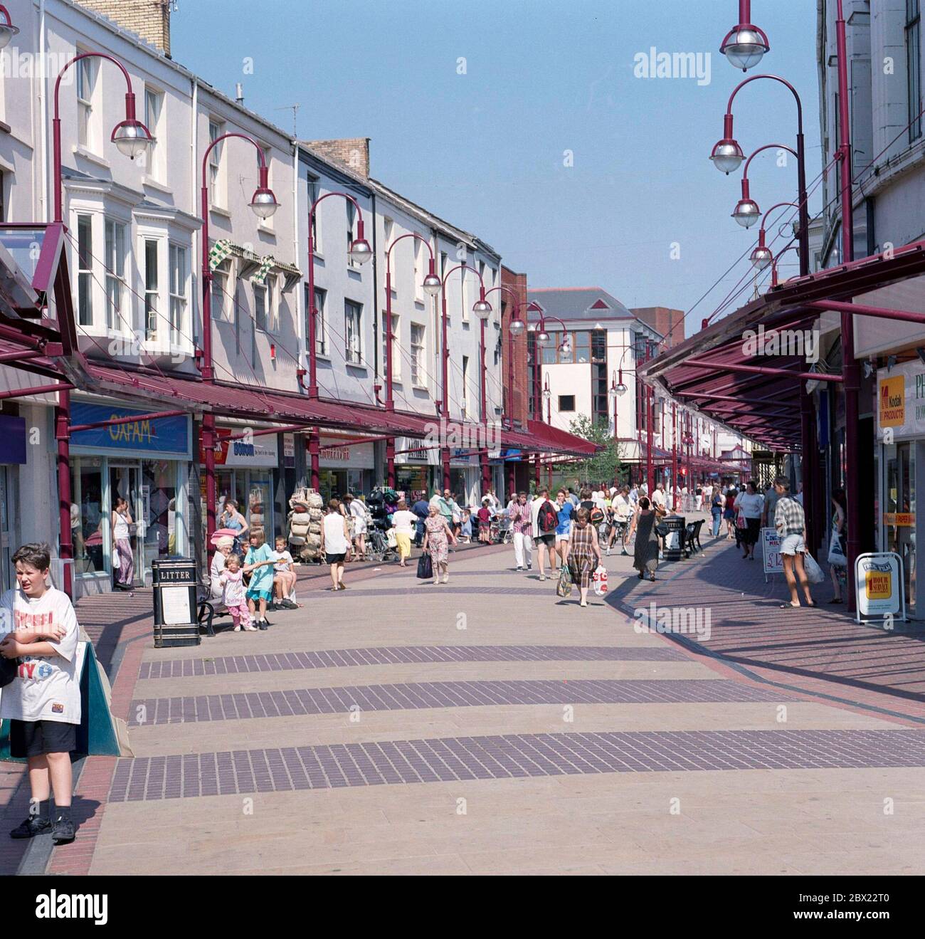 1995, Llanelli High street, with people shopping in the city centre ...