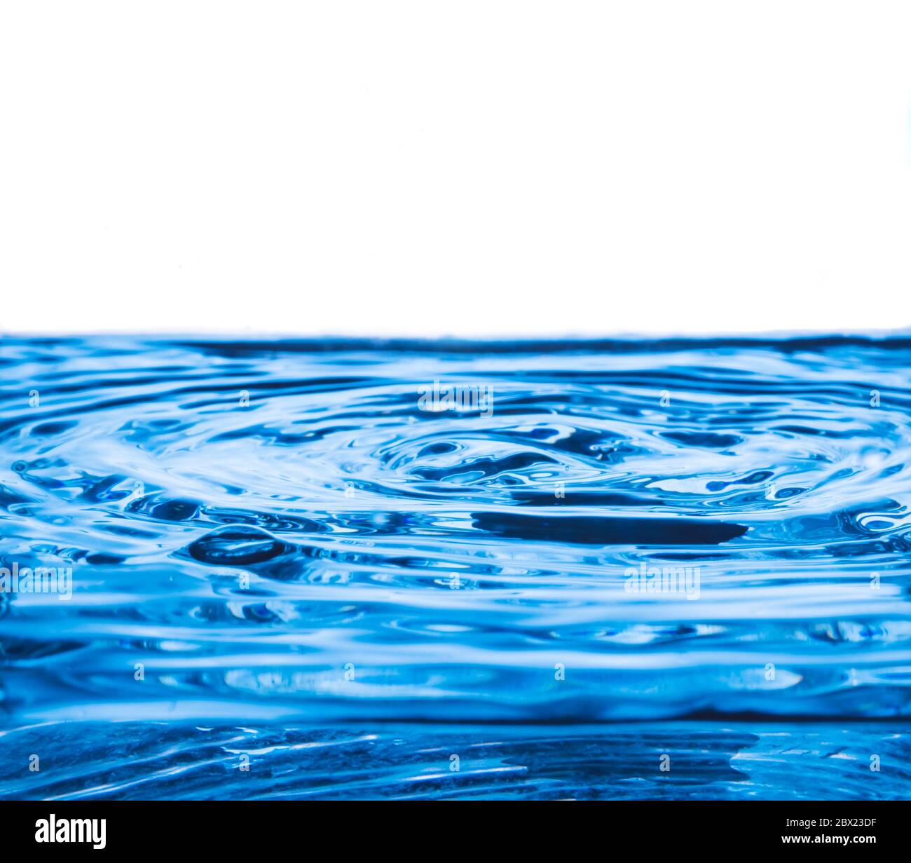 Blue wave and bubbles on water surface background Stock Photo - Alamy