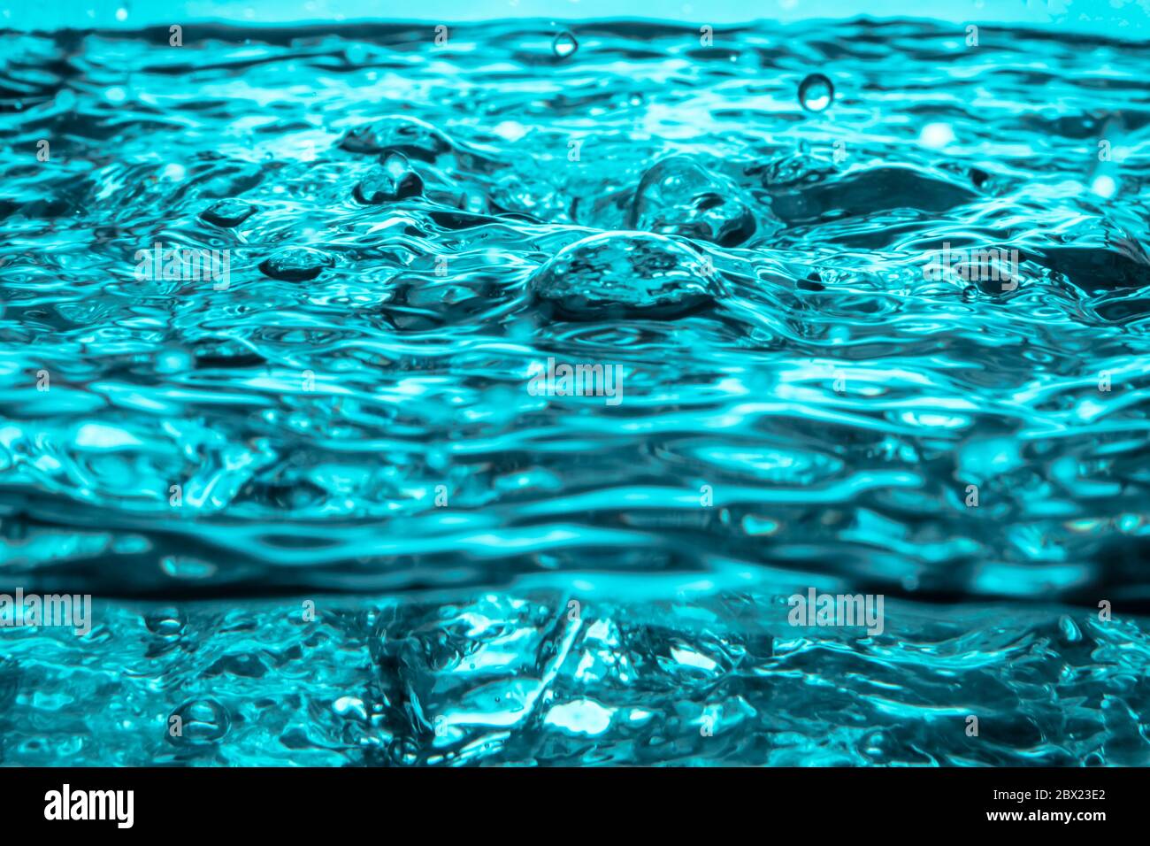 Green wave and bubbles on water surface background Stock Photo - Alamy