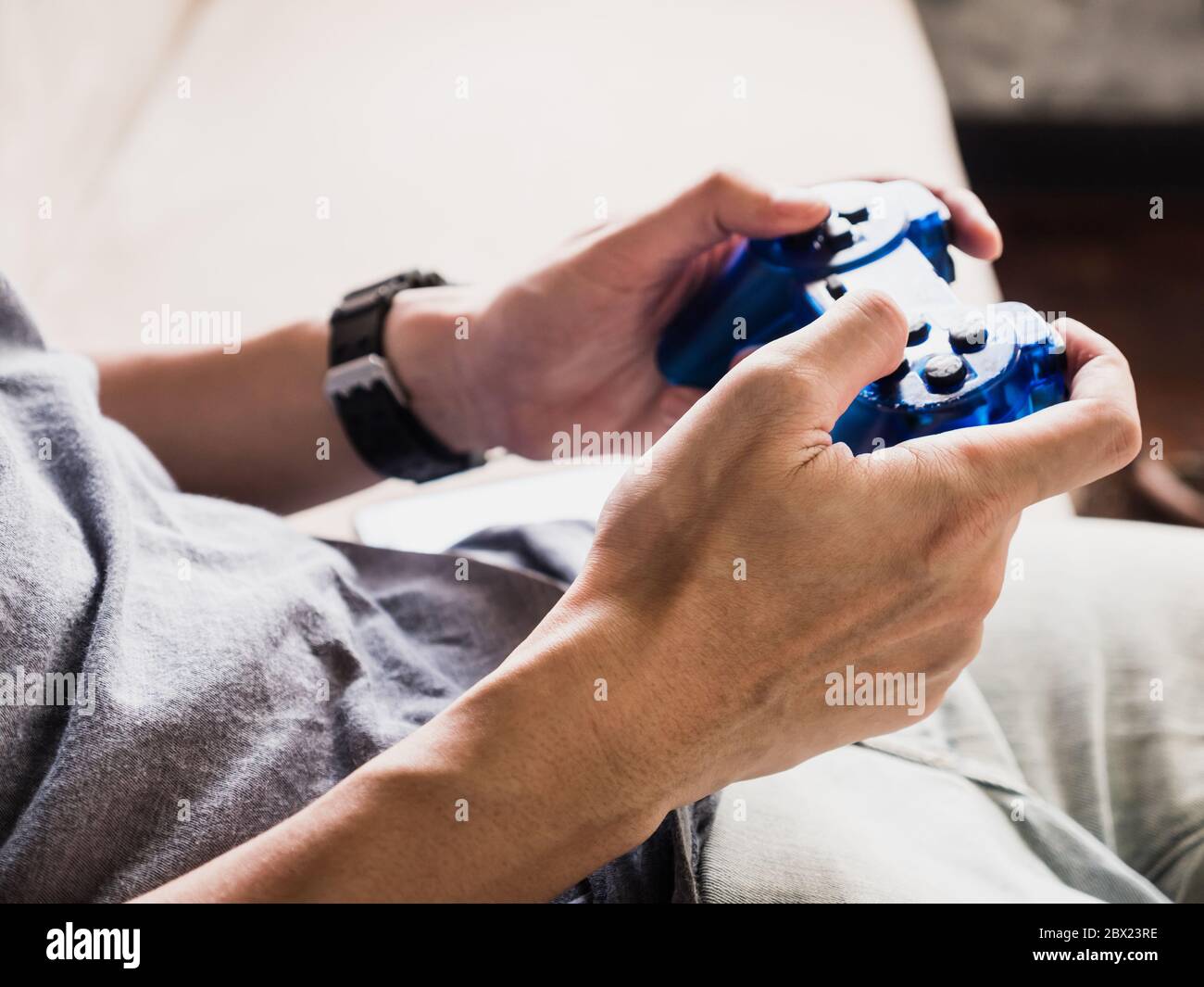 Close up of a young gamer playing the video game with a joystick Stock ...