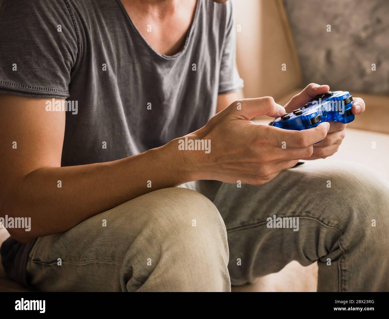 Close up of a young gamer playing the video game with a joystick Stock ...