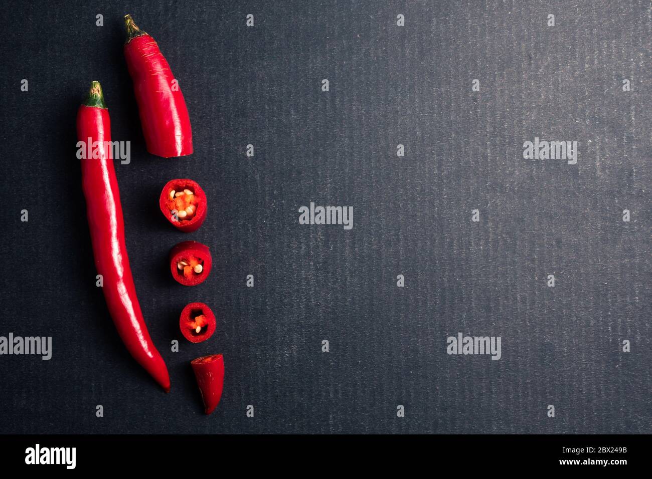 Fresh Red chili papper on black background. Free space for text Stock ...