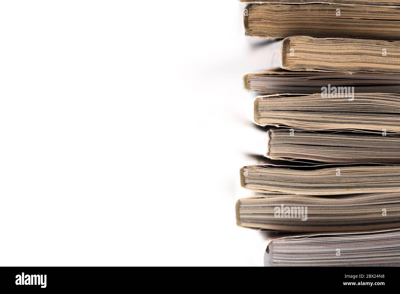 selective focus of the stacking magazine place on white background ...