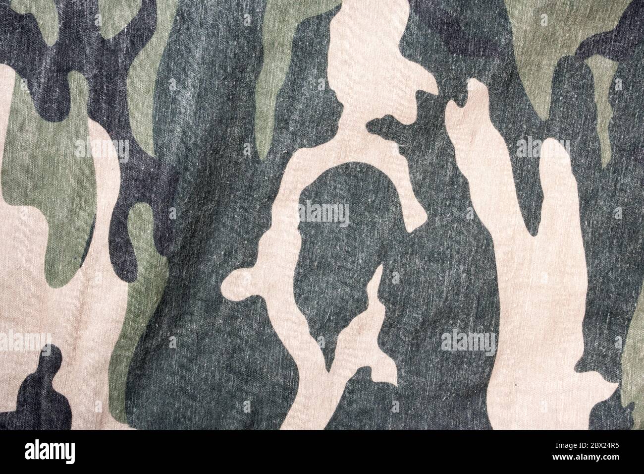 Camouflage fabric texture pattern background Stock Photo - Alamy