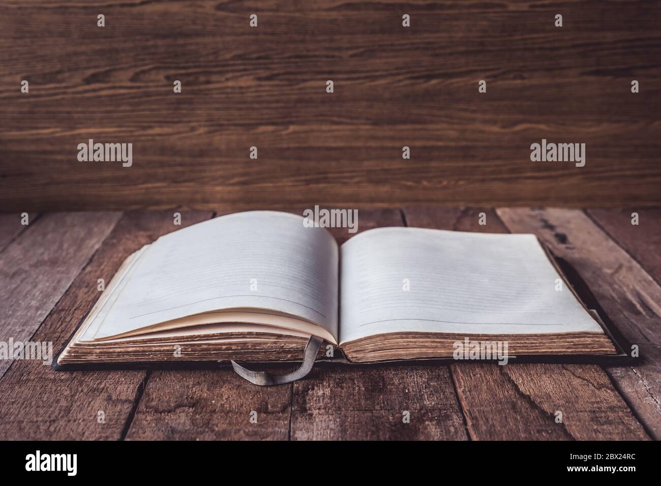 Blank old notebook on wooden table background Stock Photo - Alamy