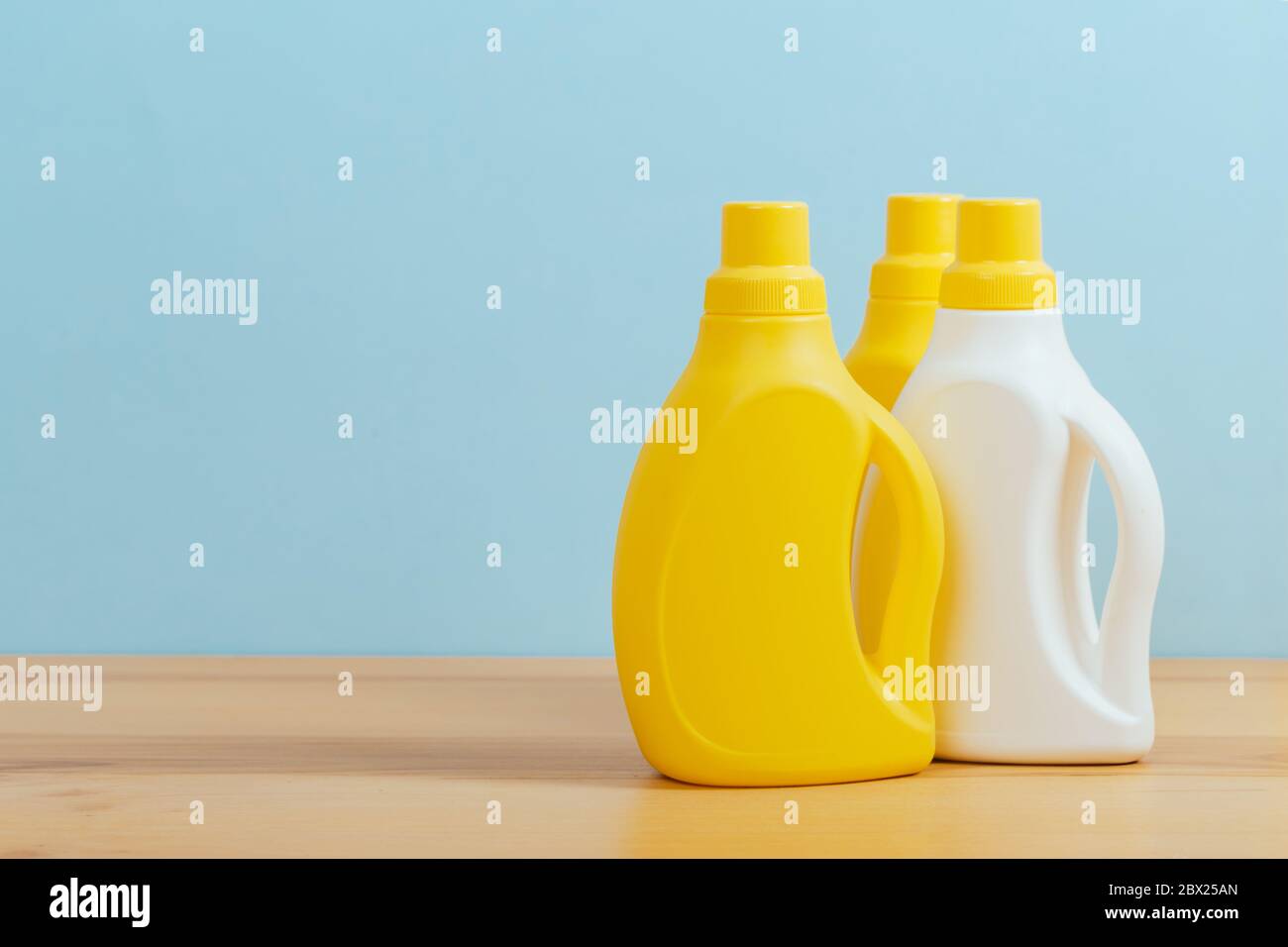 Cleaning product plastic container for house clean on wooden table and ...