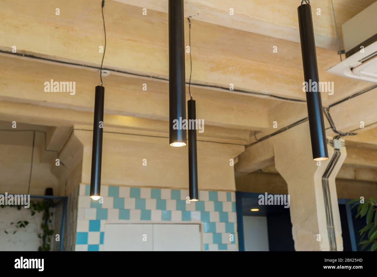 modern glass and metal loft lamps in a design office Stock Photo - Alamy