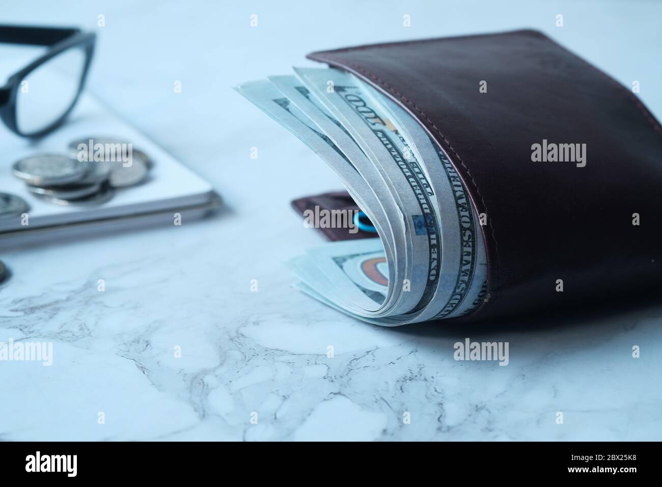 Close up of cash in wallet on table Stock Photo - Alamy