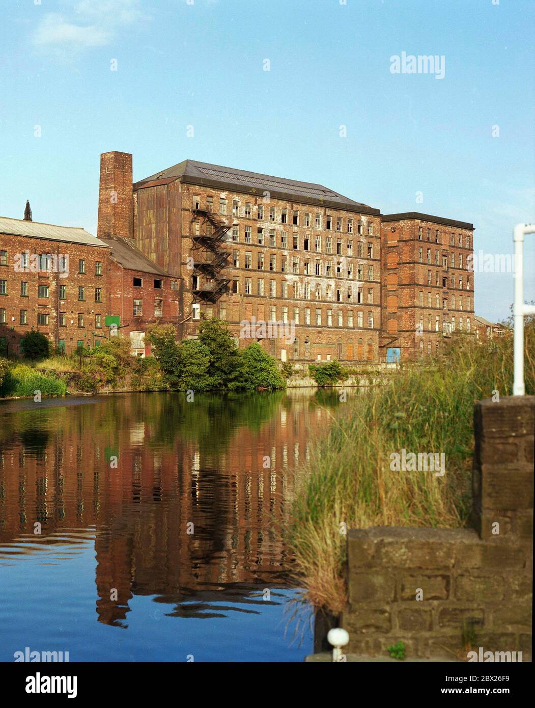 1995, Rose Wharf, a derelict old mill building next to the river Aire ...
