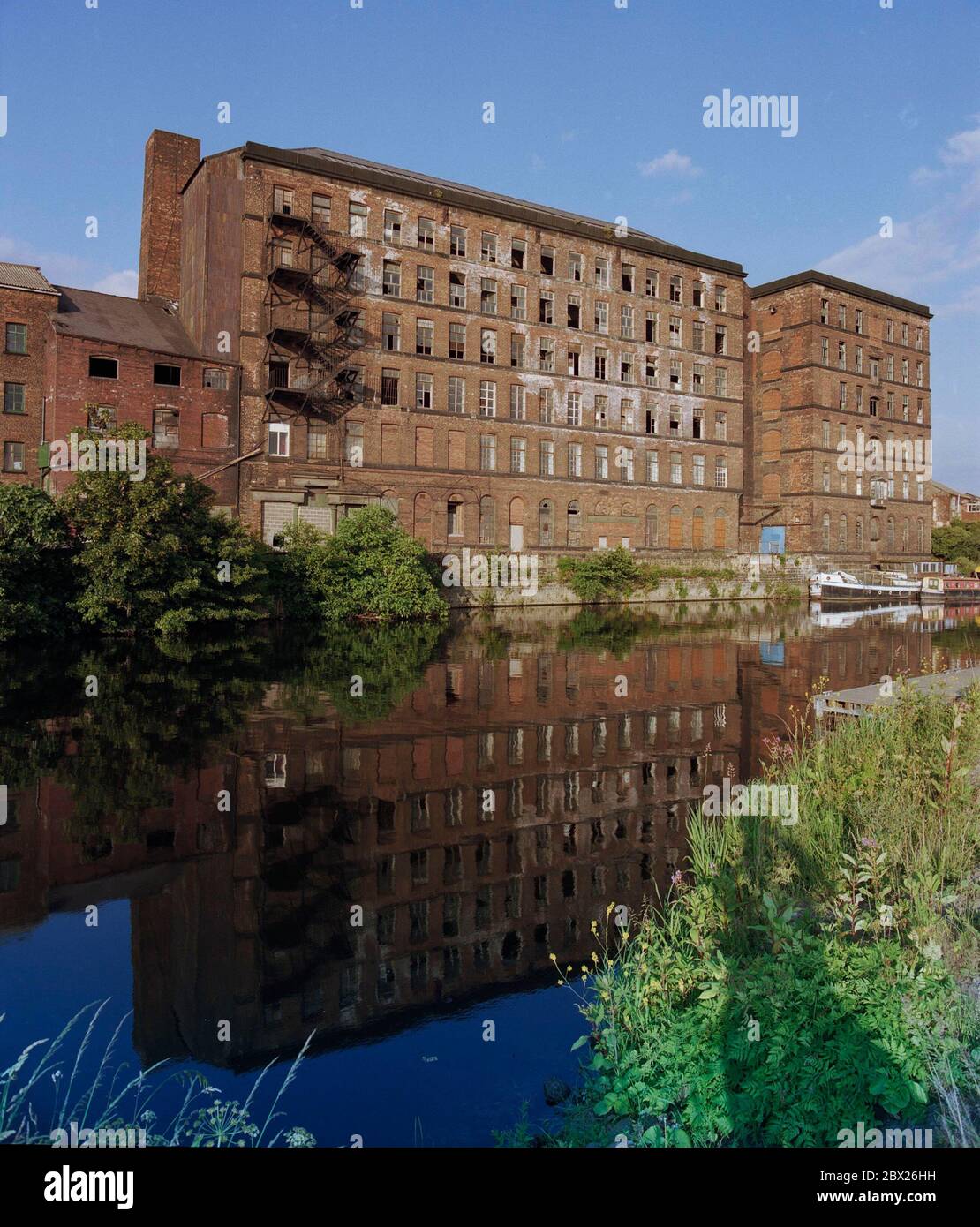 1995, Rose Wharf, a derelict old mill building next to the river Aire ...