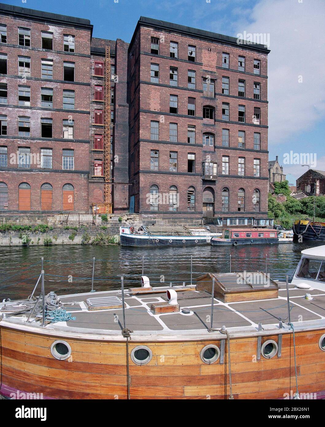 1995, Rose Wharf, a derelict old mill building next to the river Aire ...