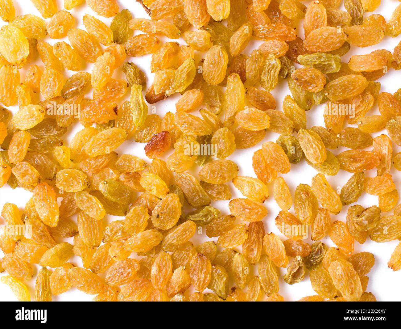 Fresh raisin in a green bowl with a white background Stock Photo - Alamy