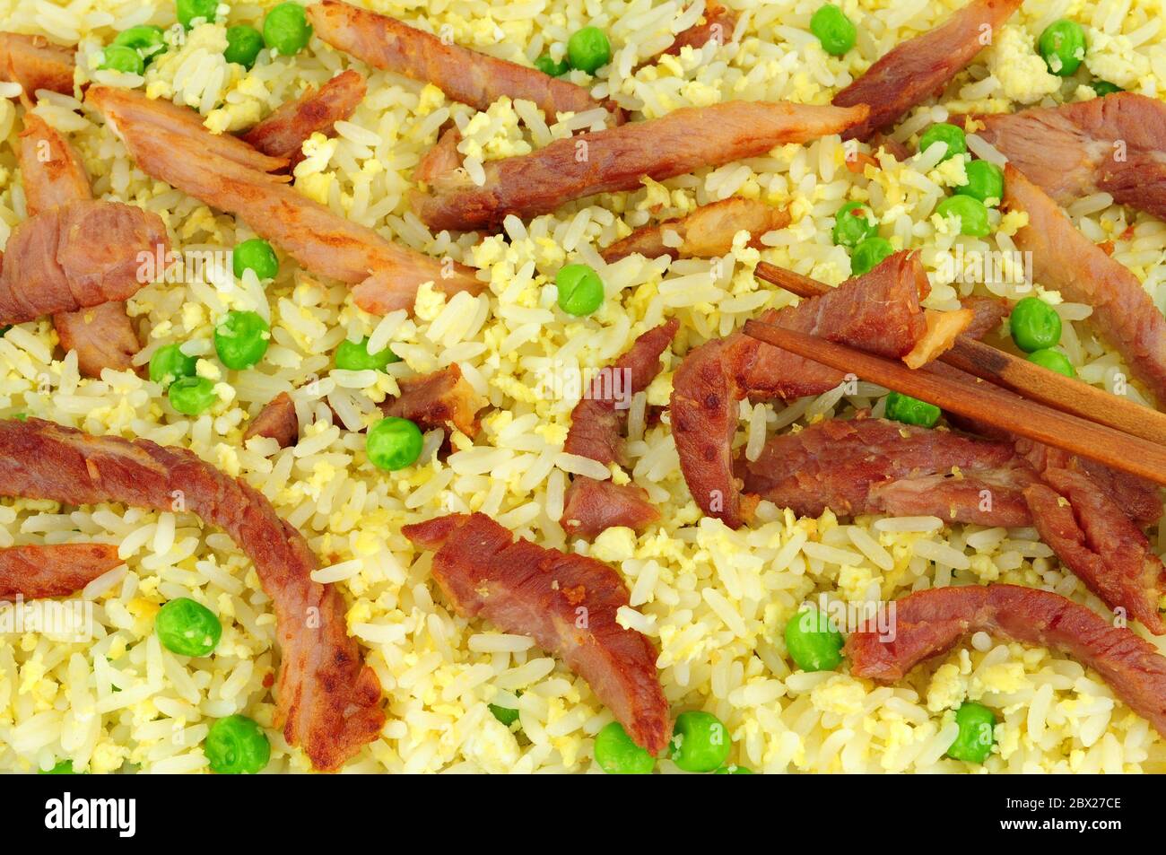 Egg fried rice with peas and pork strips background Stock Photo - Alamy