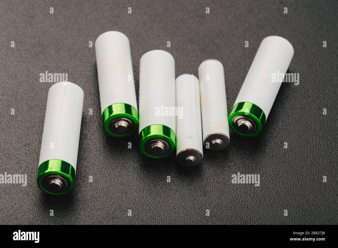 close up of battery positive poles on black backgrounds. intended ...