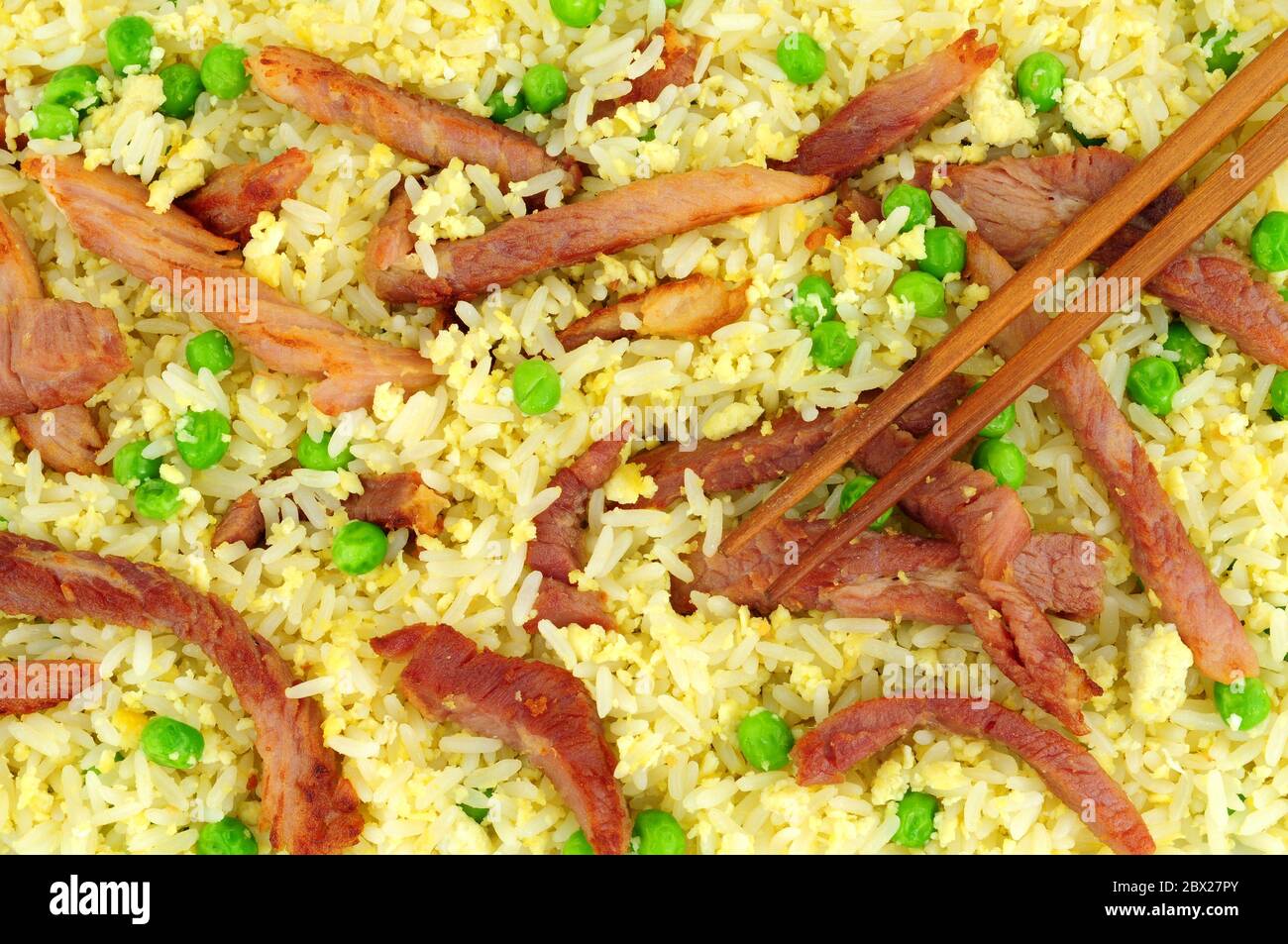 Egg fried rice with peas and pork strips background Stock Photo - Alamy