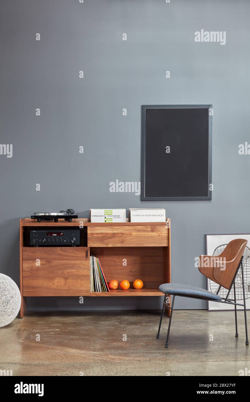 Custom wood stereo cabinet against grey wall Stock Photo - Alamy